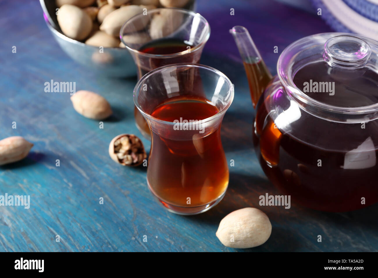 Turkish tea in traditional glasses on color wooden table Stock Photo ...