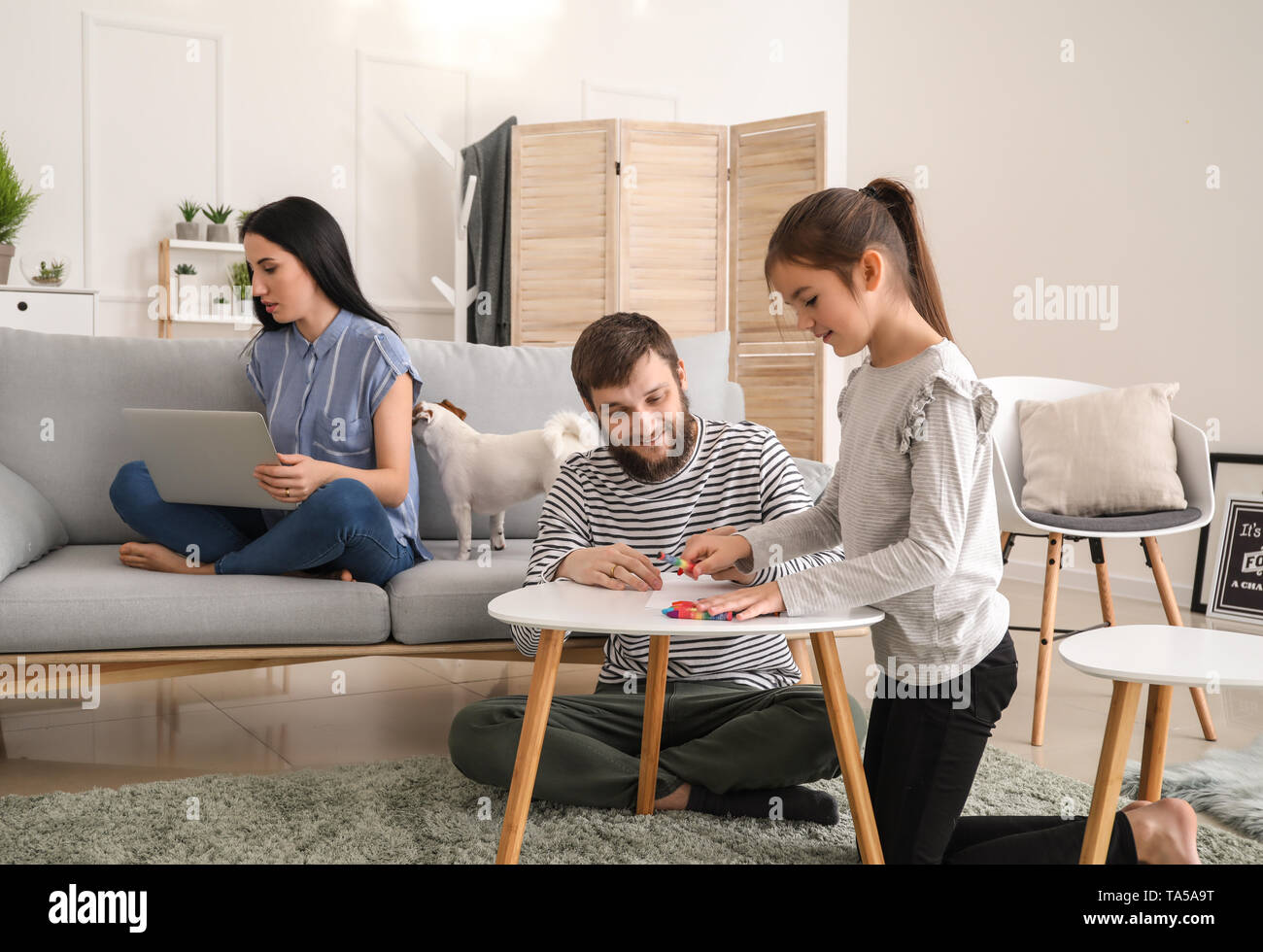 Happy family spending time at home Stock Photo - Alamy