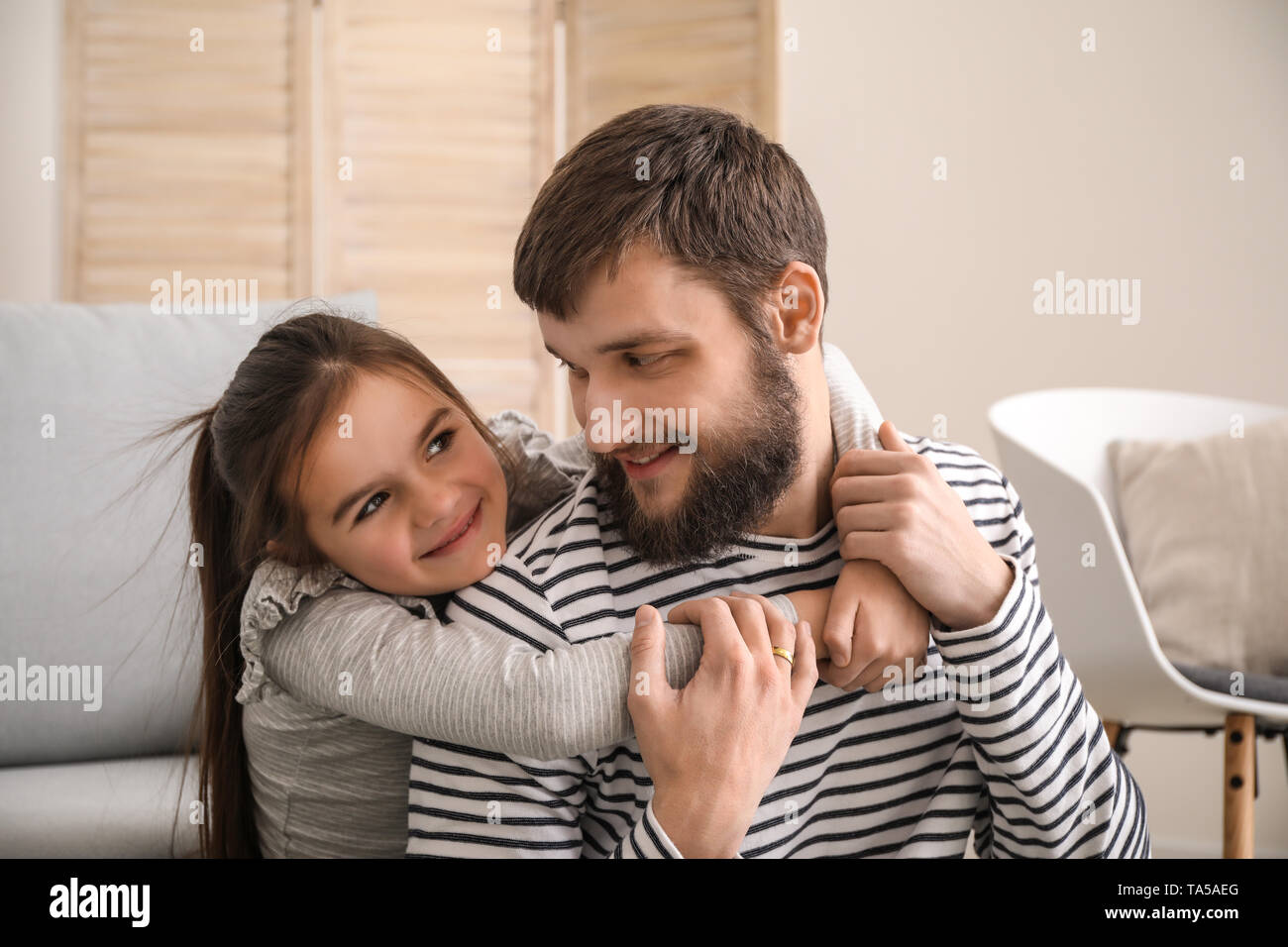 Father with his cute little daughter at home Stock Photo - Alamy