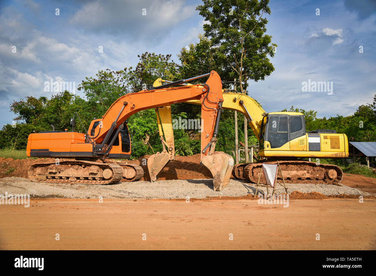 road construction with backhoe loader / yellow and orange modern ... road construction with backhoe loader / yellow and orange modern ...