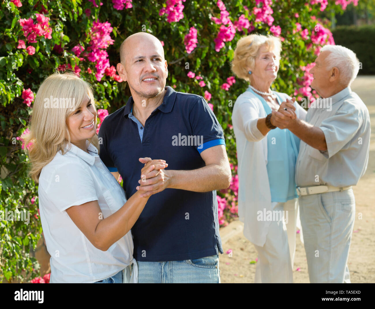 Mother daughter dancing in garden hi-res stock photography and images ...