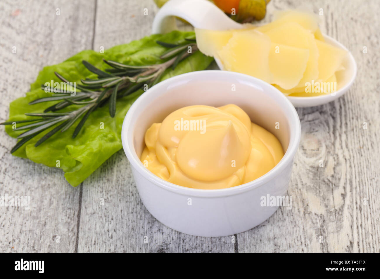 Cheese sauce in the bowl served sliced parmesan Stock Photo - Alamy