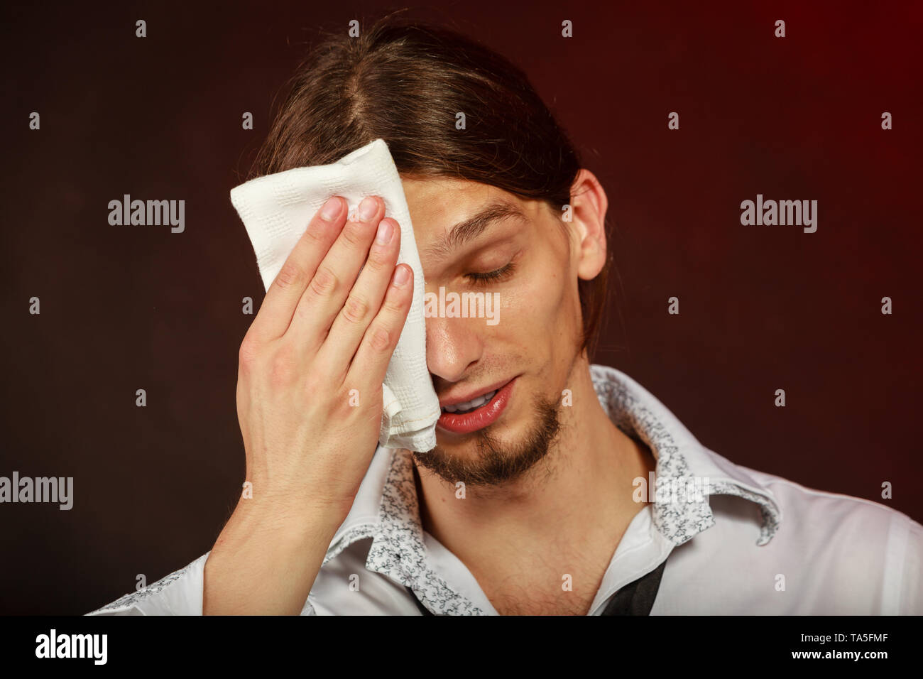 Man wiping face napkin hi-res stock photography and images - Alamy