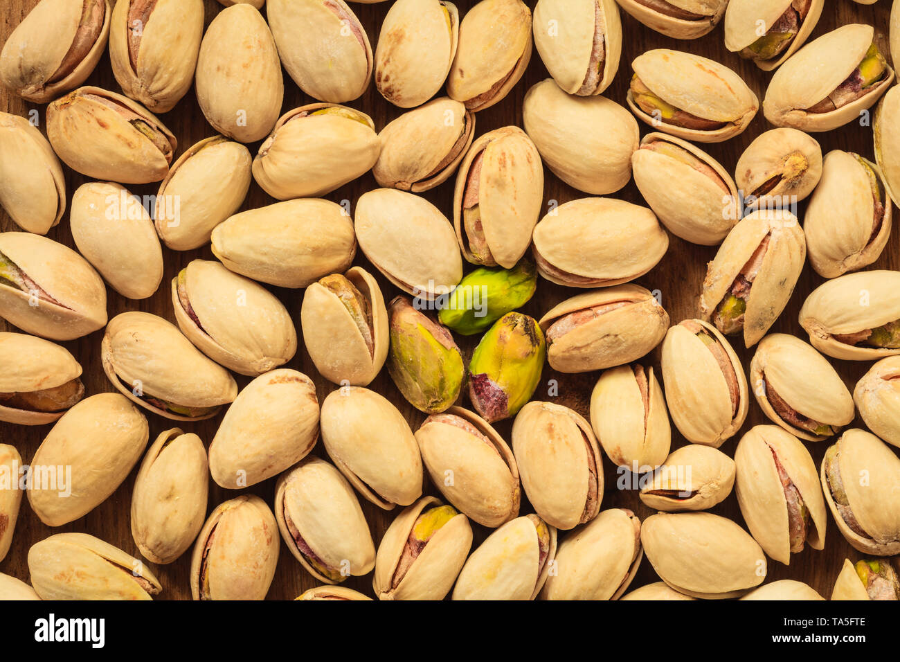 Diet healthcare concept. Food background. Roasted pistachio nuts seed with shell close up Stock ...