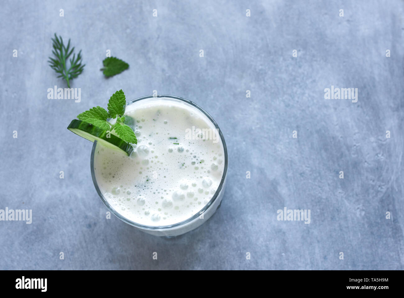 Ayran, homemade yogurt drink (kefir, lassi) with herbs and cucumbers ...