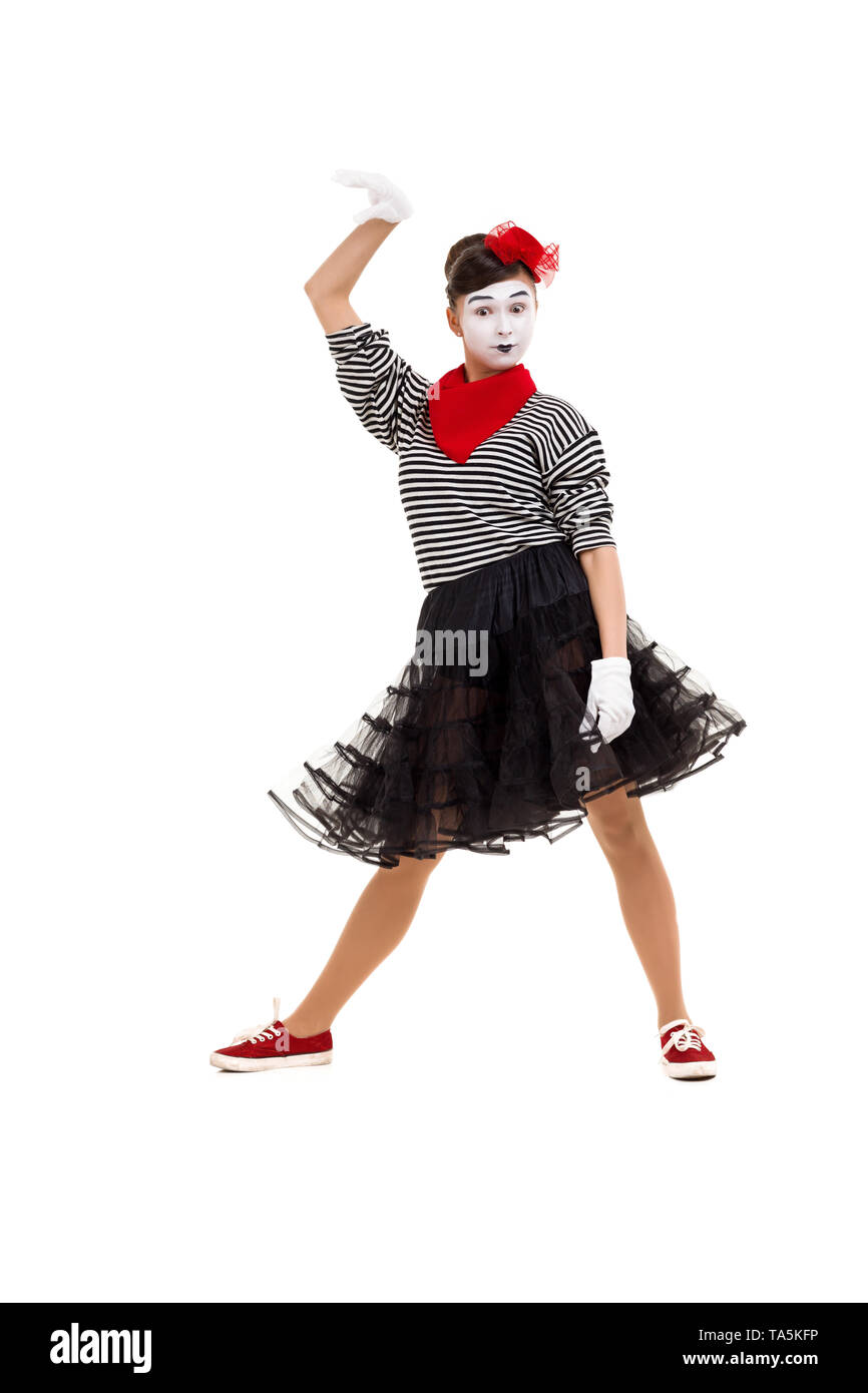 Full length portrait of a mime woman artist looking at camera isolated ...