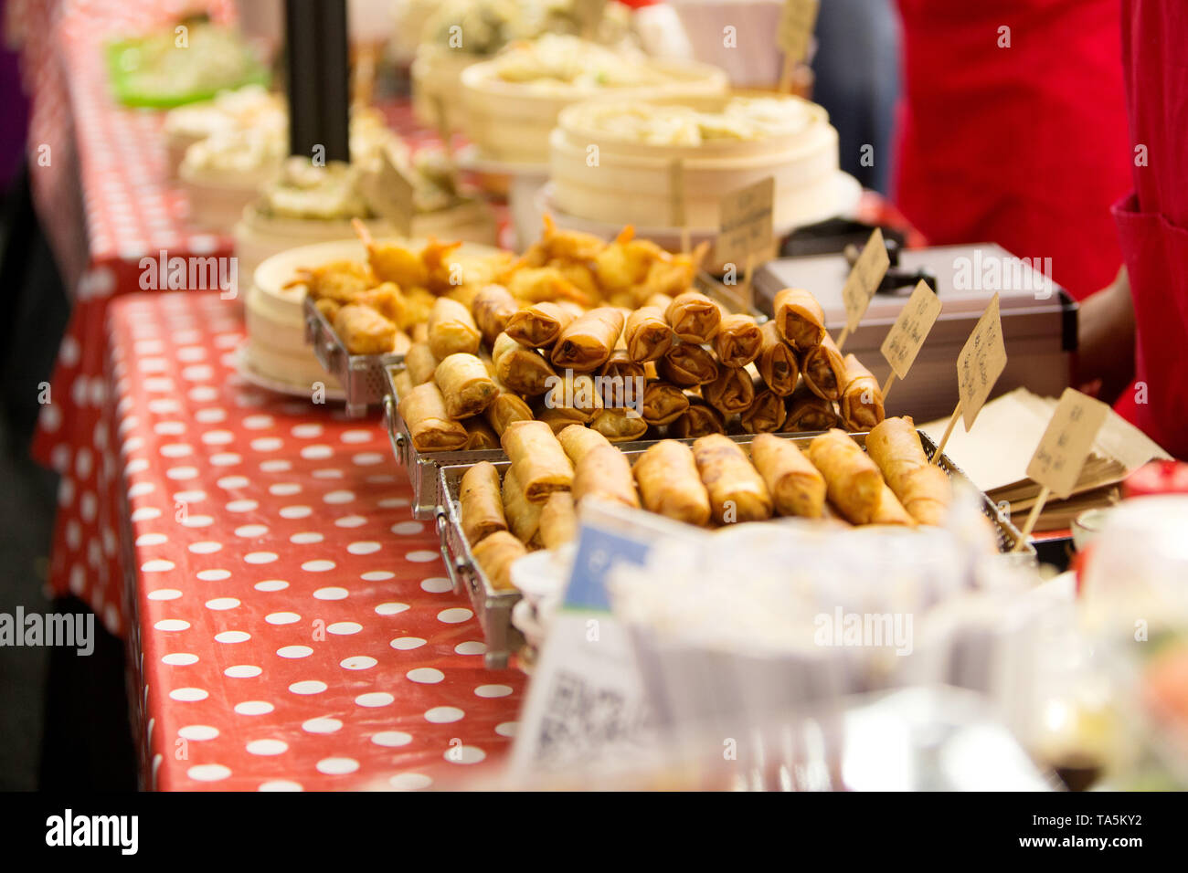 A pile of spring roll food snack on display at a food market Stock ...