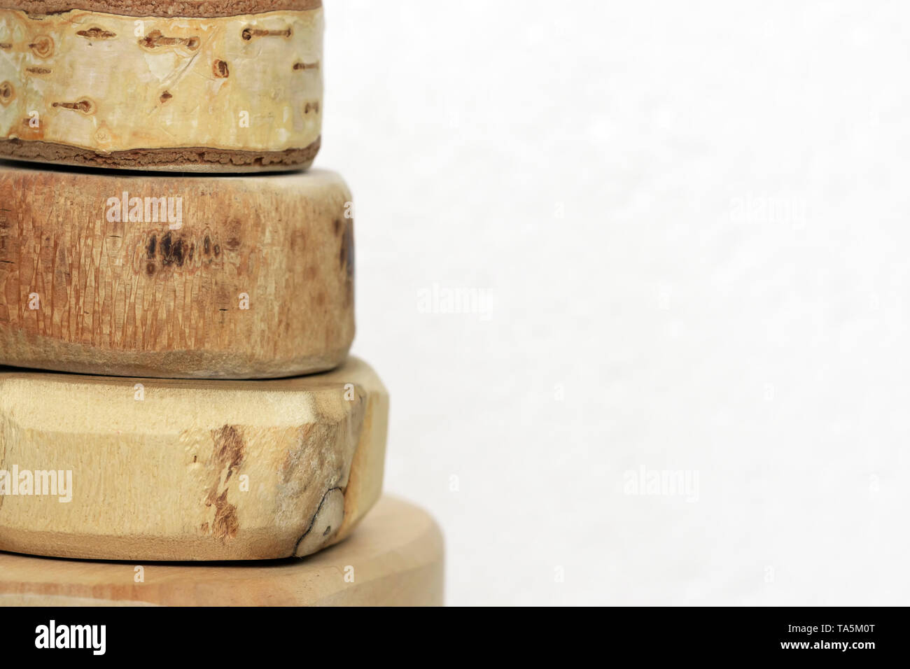 A wooden pyramid of treated wood on a white background with a place for ...