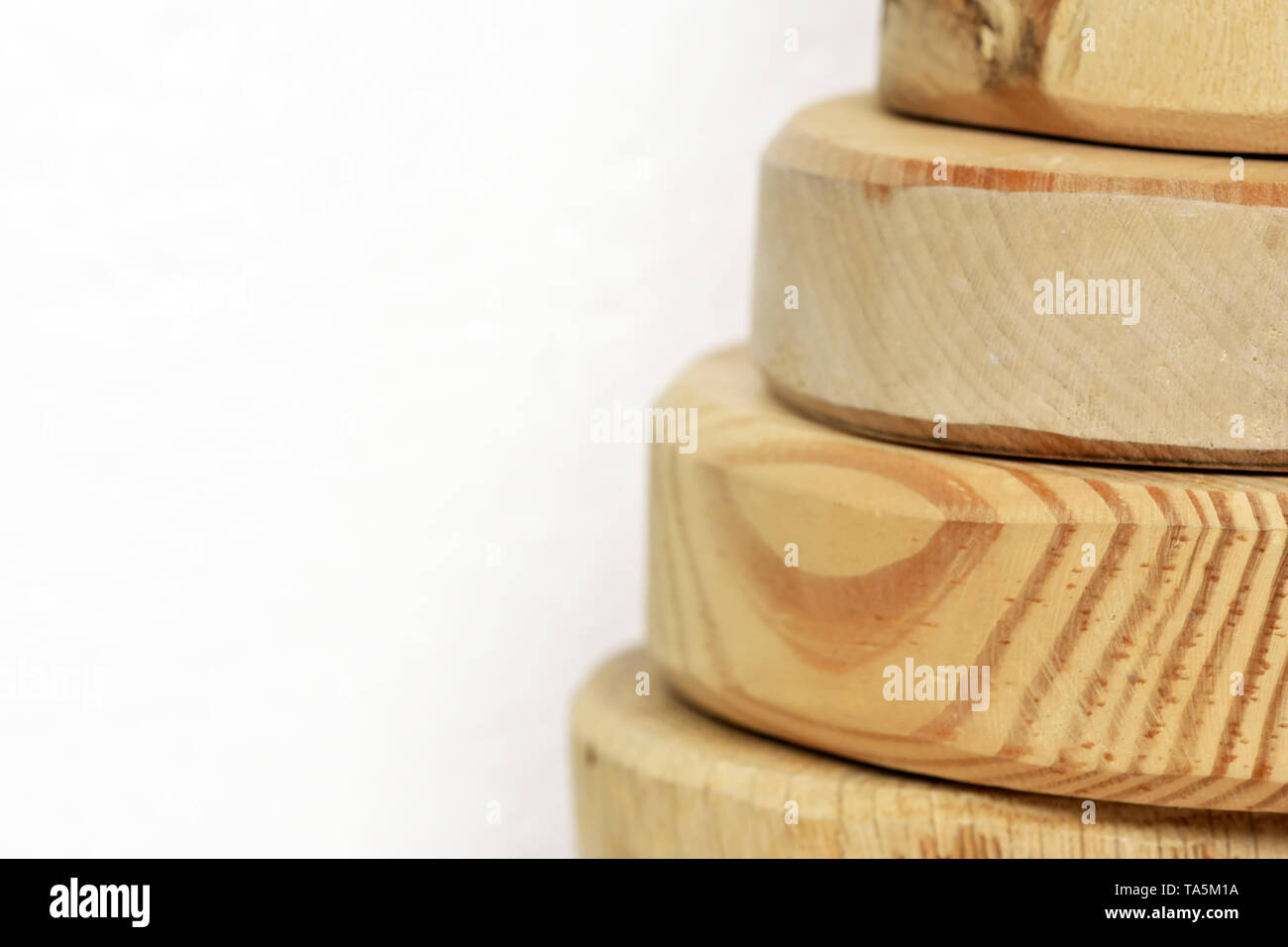 A wooden pyramid of treated wood on a white background with a place for ...