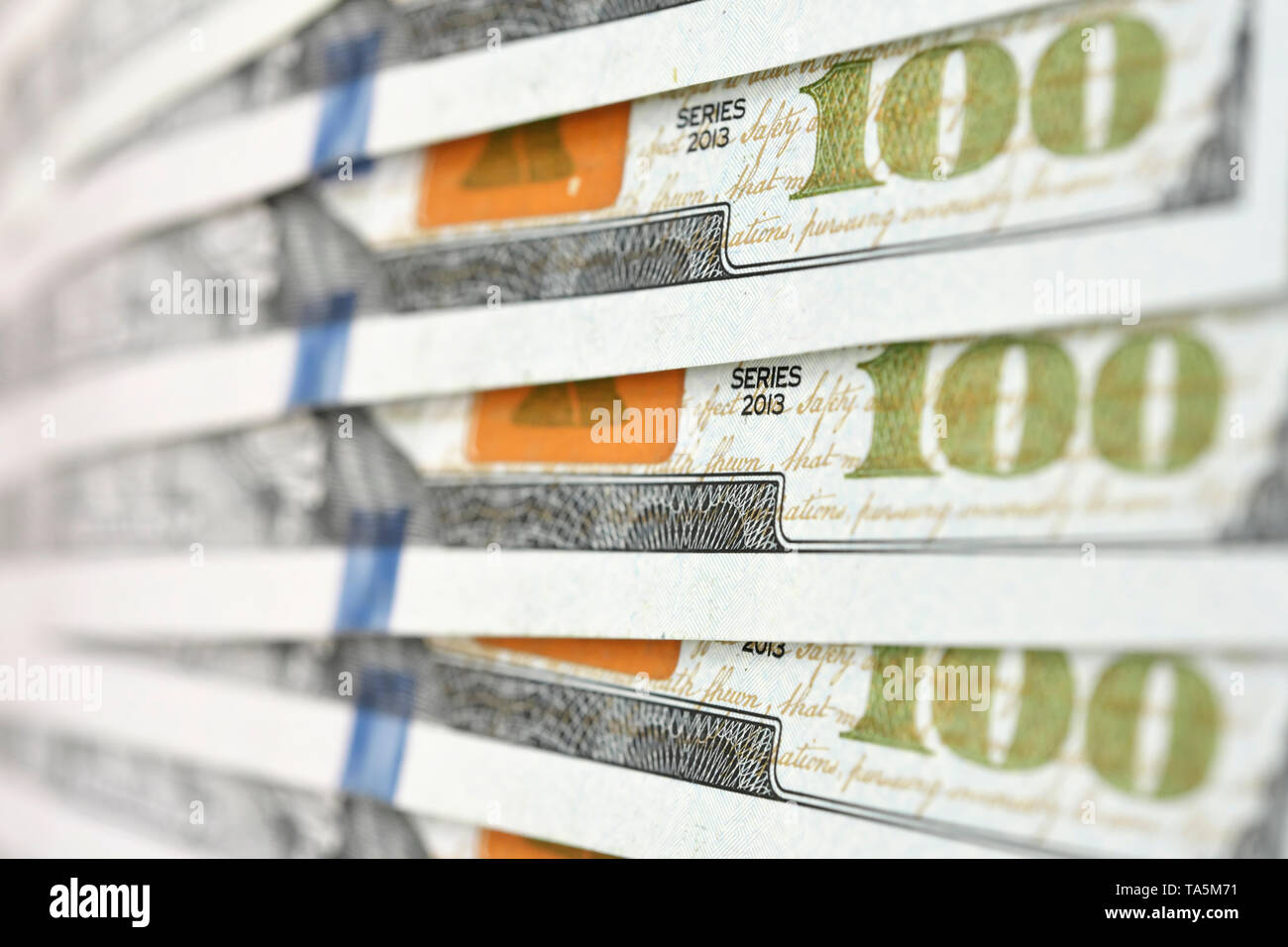 US paper banknotes in denominations of one hundred US dollars close-up ...