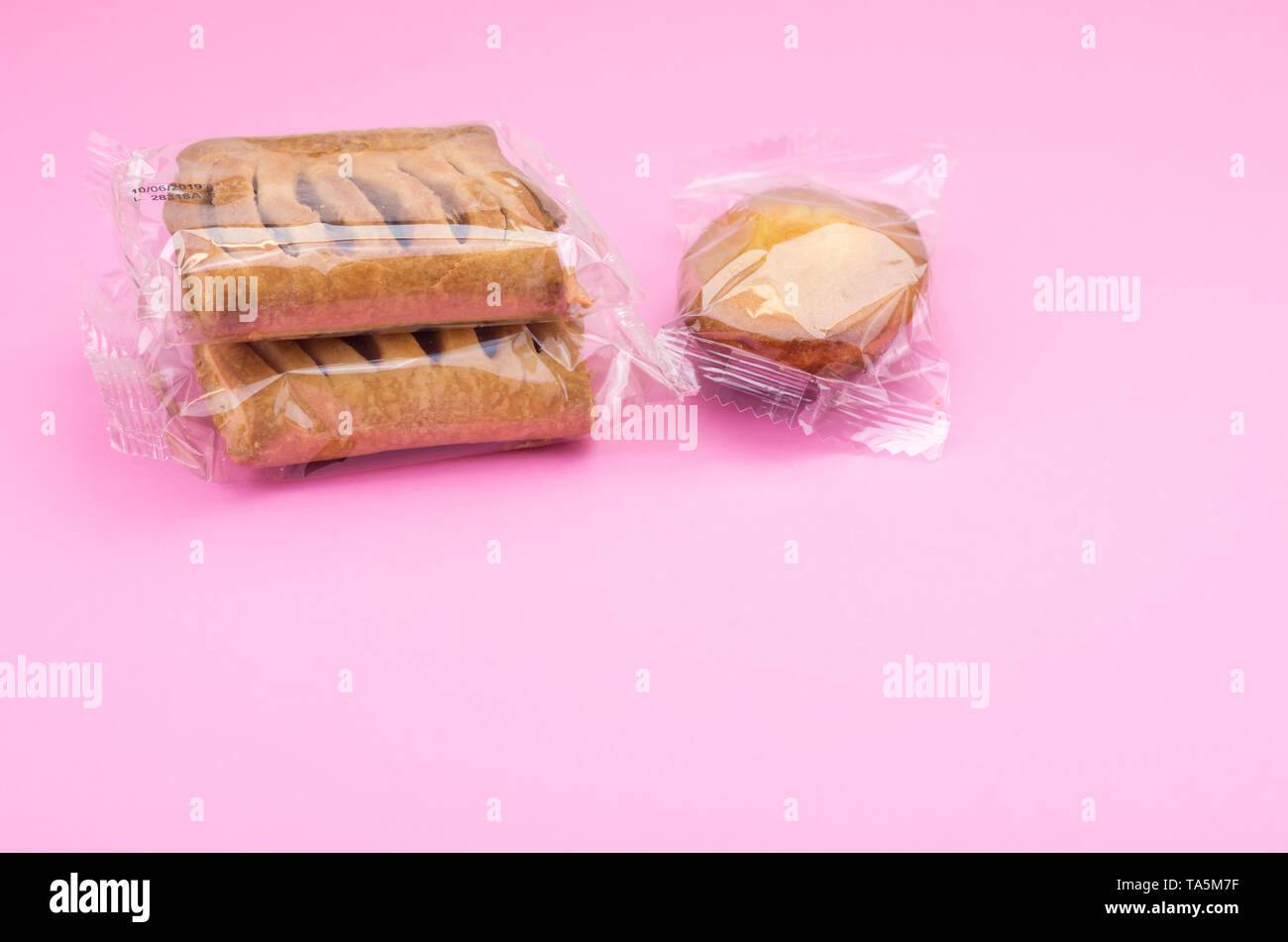 pre packaged snacks and pastries on a blank surface Stock Photo - Alamy