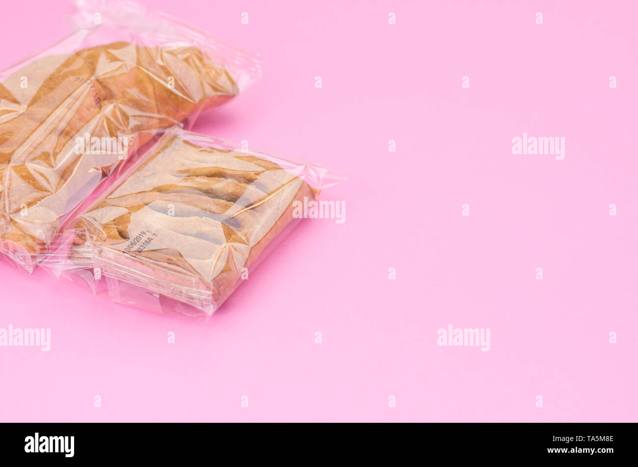 pre packaged snacks and pastries on a blank surface Stock Photo - Alamy
