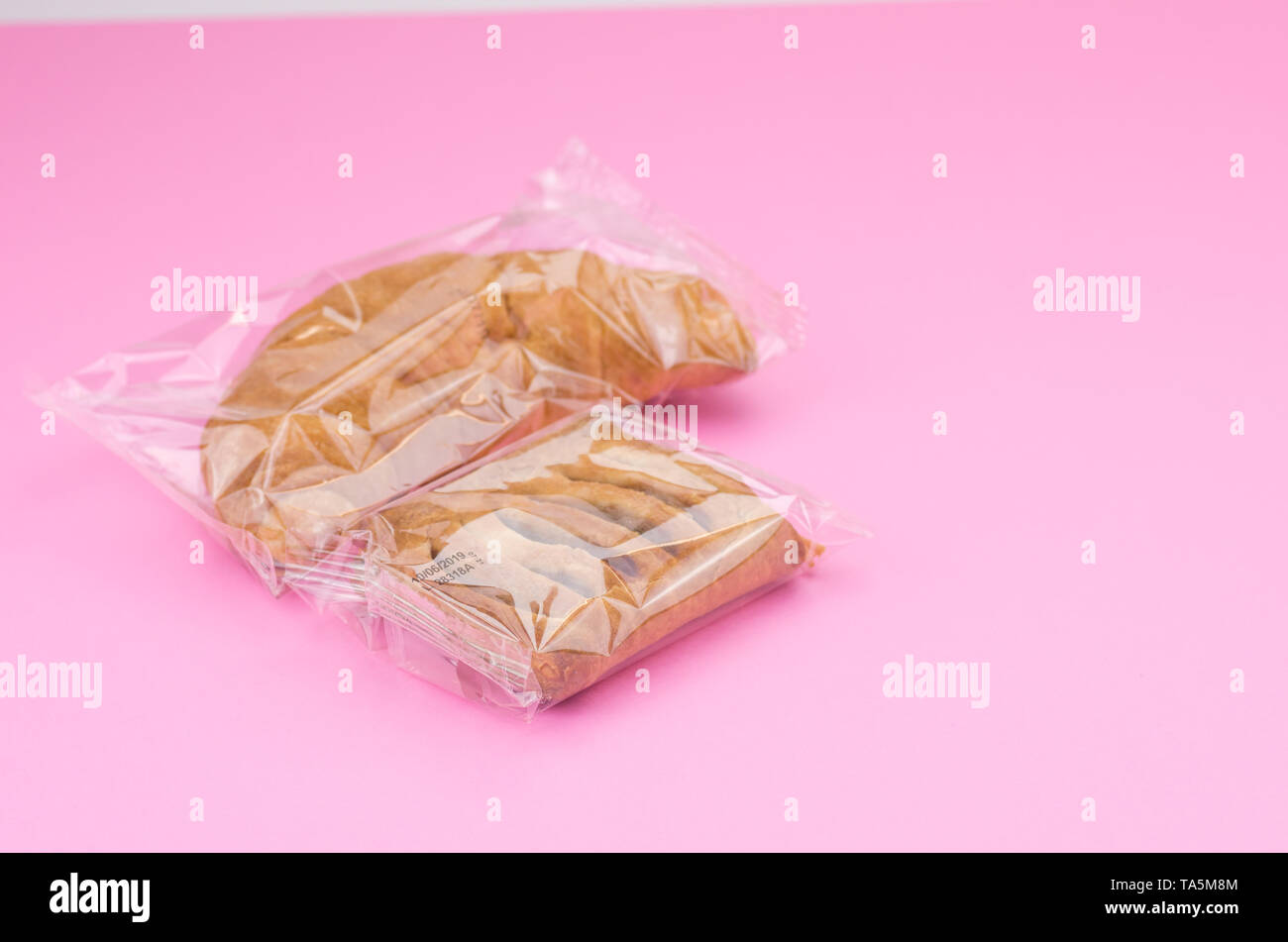 pre packaged snacks and pastries on a blank surface Stock Photo - Alamy