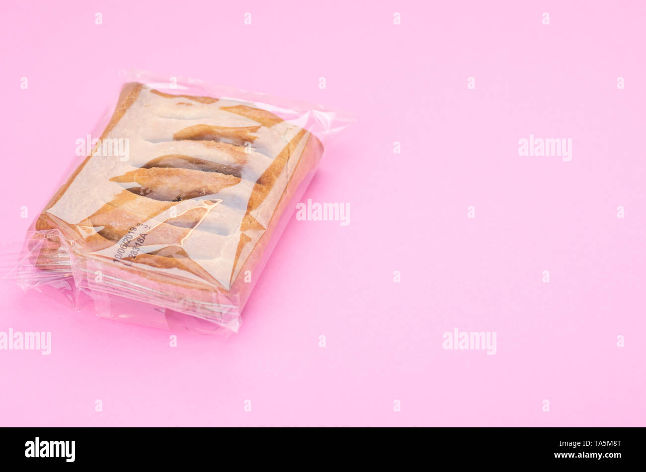pre packaged snacks and pastries on a blank surface Stock Photo - Alamy