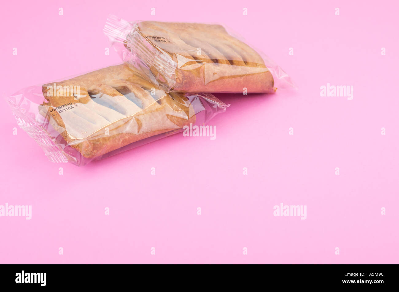 pre packaged snacks and pastries on a blank surface Stock Photo - Alamy