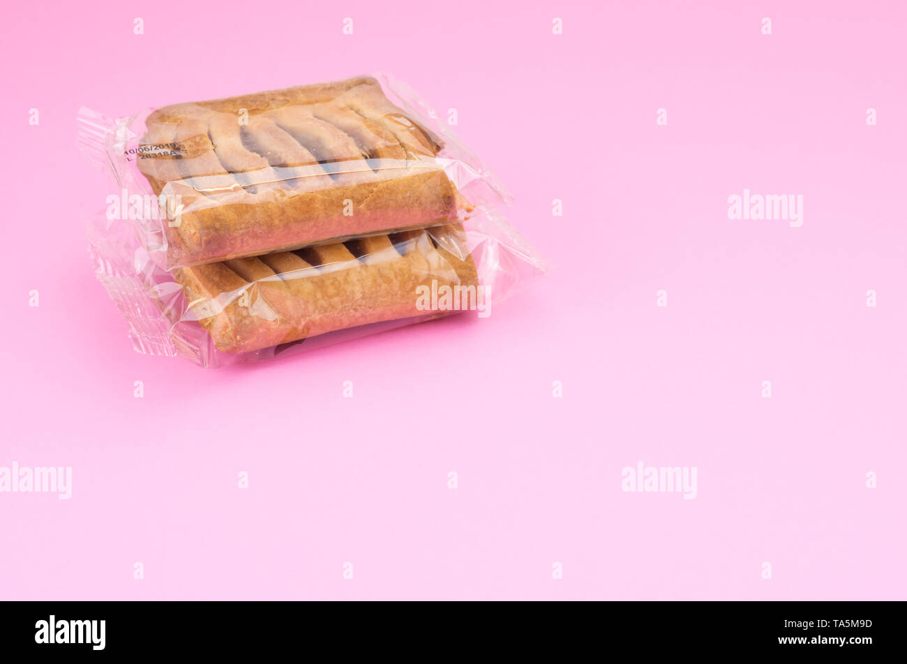 pre packaged snacks and pastries on a blank surface Stock Photo - Alamy