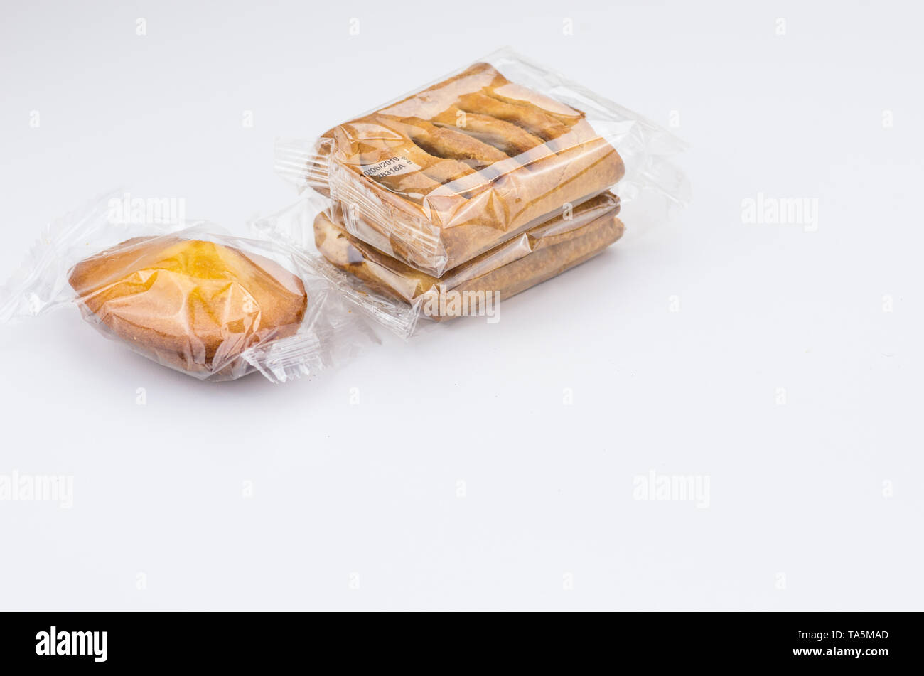 pre packaged snacks and pastries on a blank surface Stock Photo - Alamy