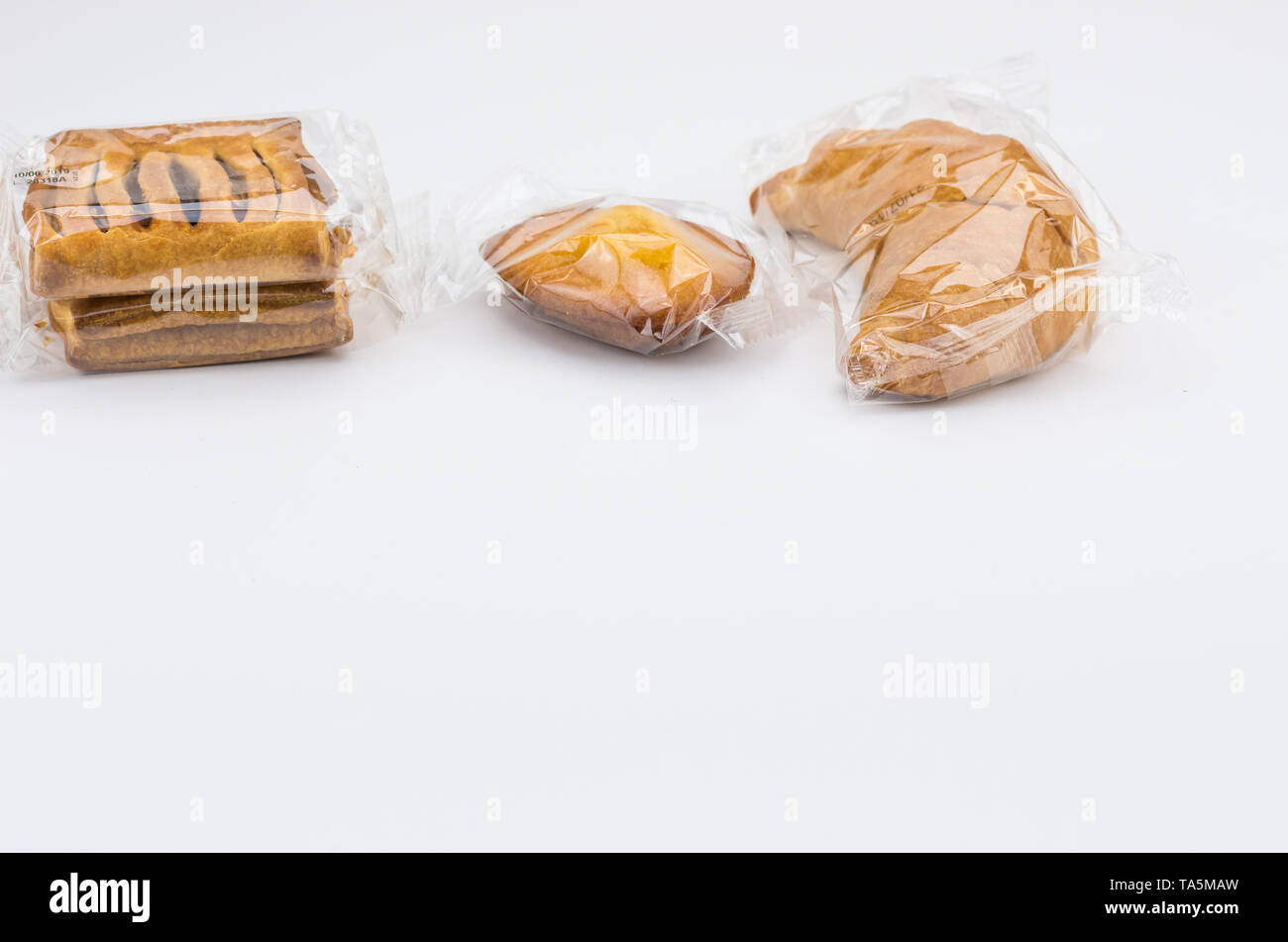 pre packaged snacks and pastries on a blank surface Stock Photo - Alamy