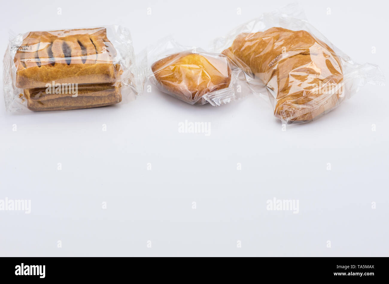 pre packaged snacks and pastries on a blank surface Stock Photo - Alamy