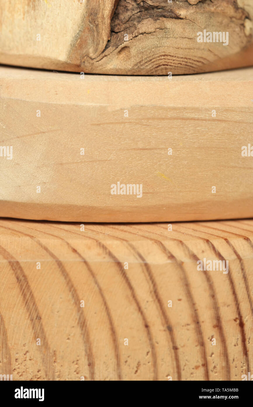 Wooden pyramid from processed wood of different textures close-up macro ...