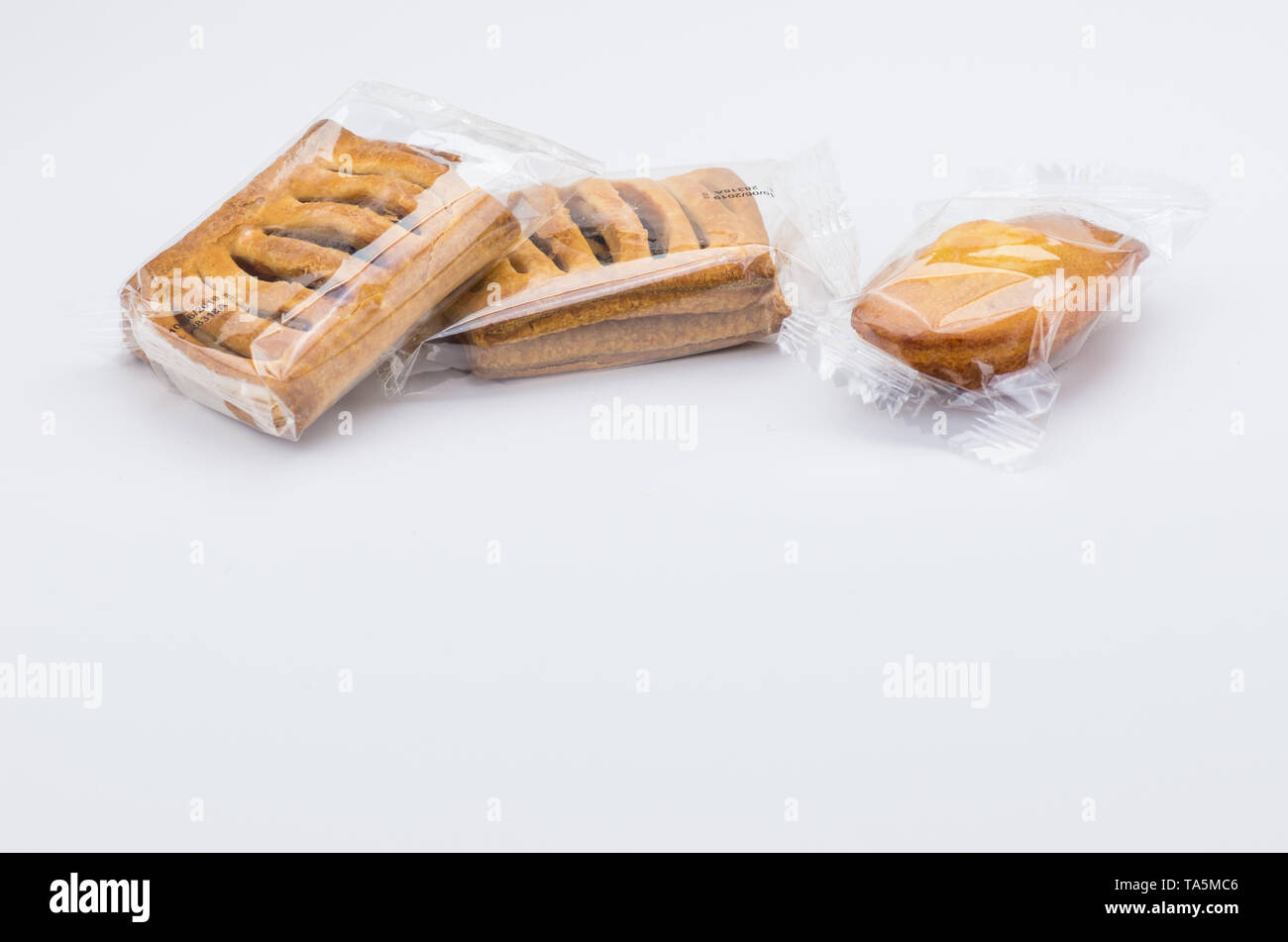 pre packaged snacks and pastries on a blank surface Stock Photo - Alamy