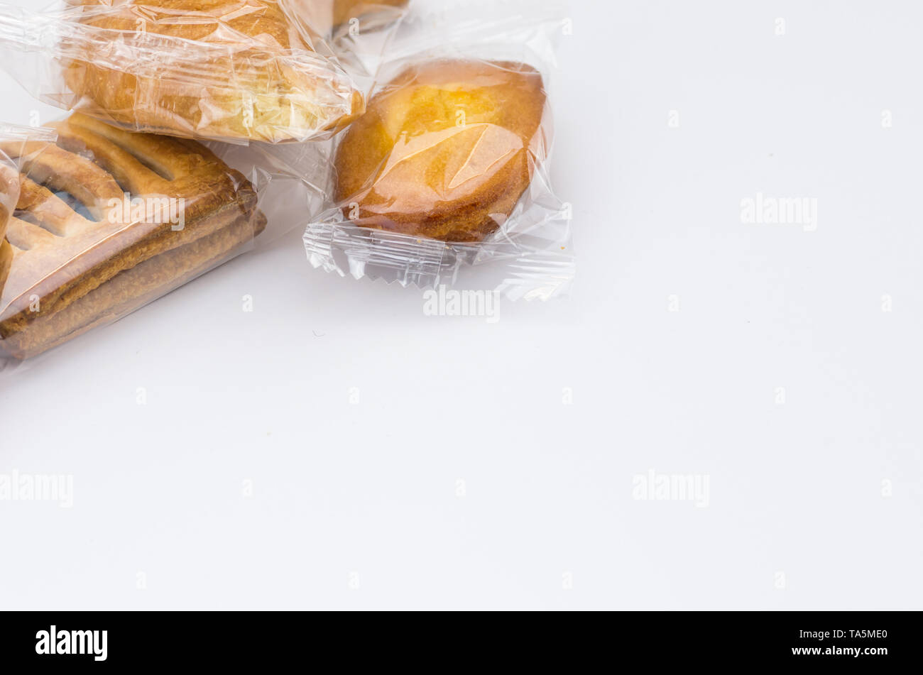 pre packaged snacks and pastries on a blank surface Stock Photo - Alamy