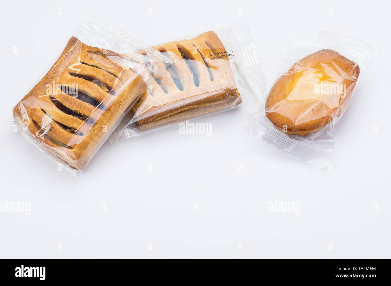pre packaged snacks and pastries on a blank surface Stock Photo - Alamy
