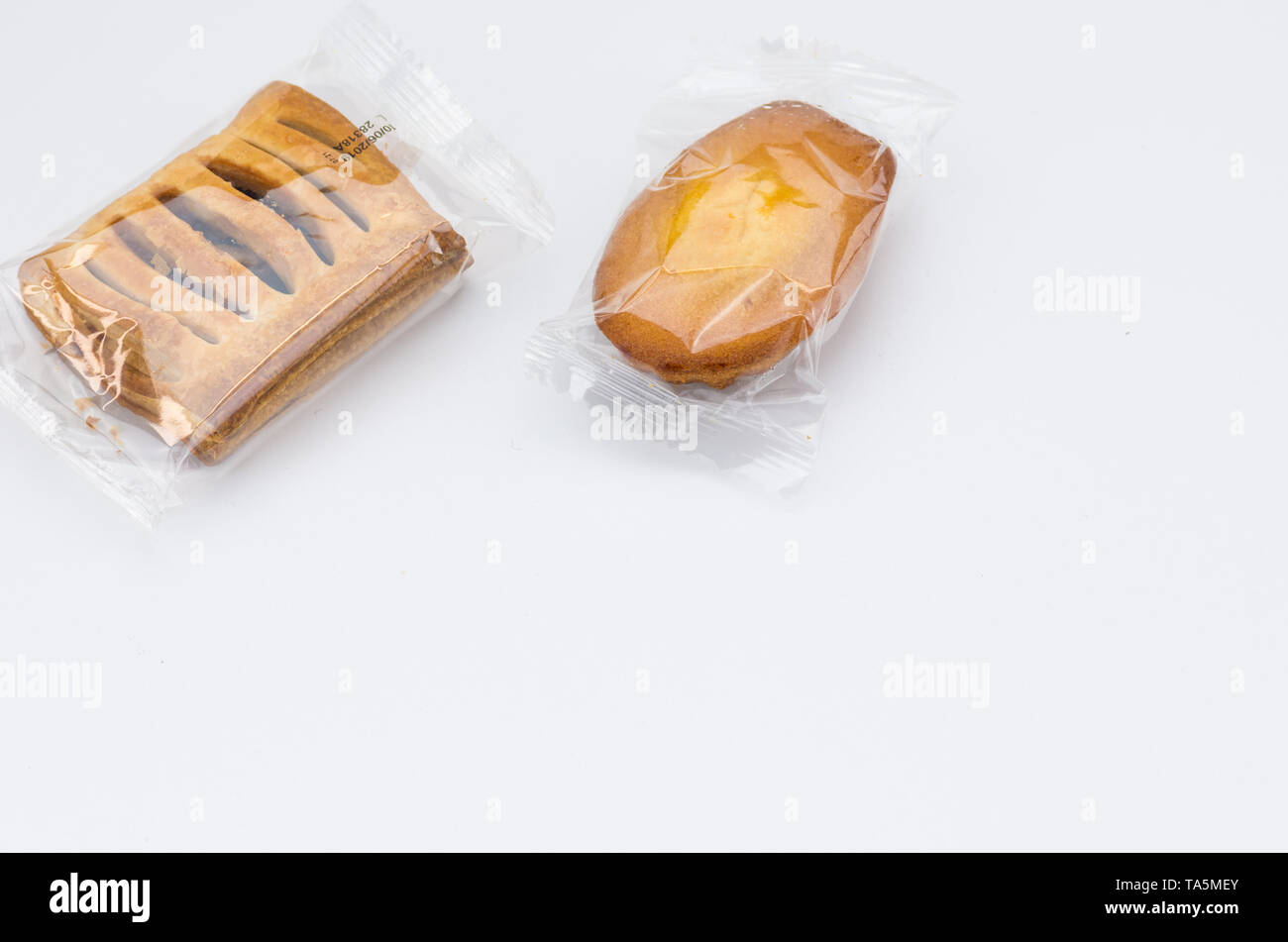 pre packaged snacks and pastries on a blank surface Stock Photo - Alamy