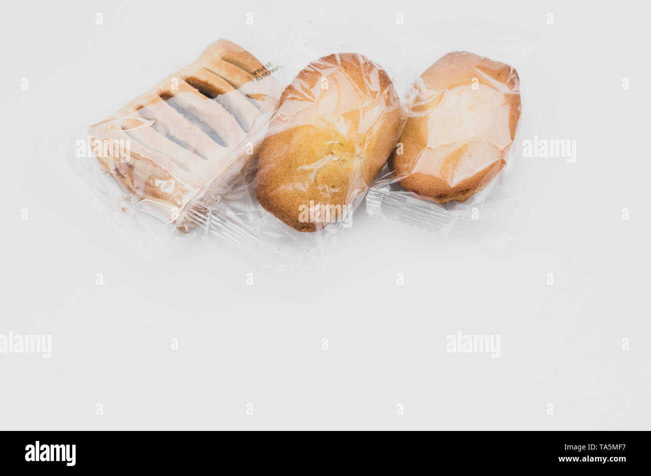 pre packaged snacks and pastries on a blank surface Stock Photo - Alamy
