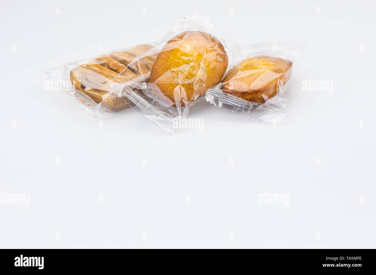 pre packaged snacks and pastries on a blank surface Stock Photo - Alamy