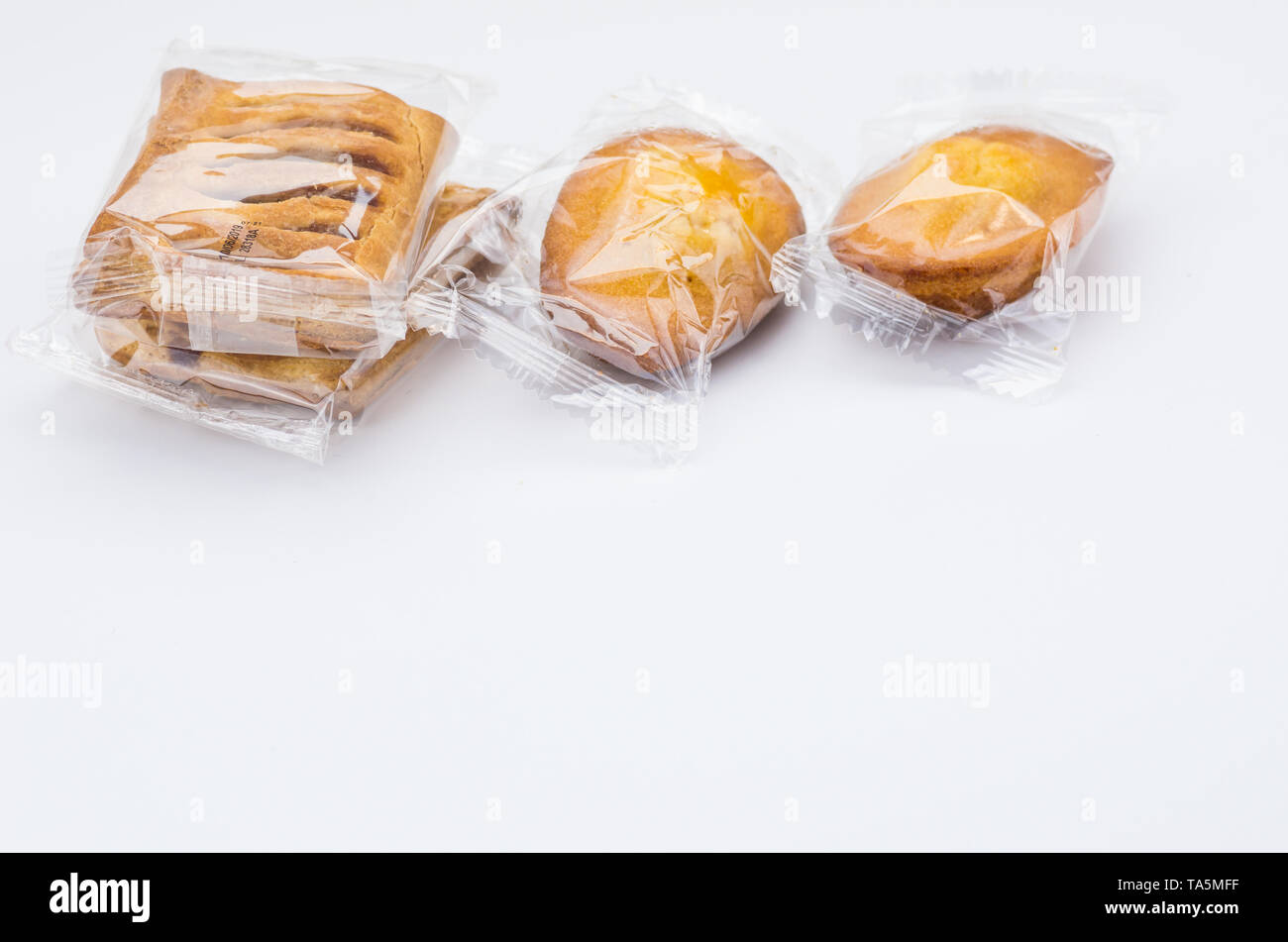 pre packaged snacks and pastries on a blank surface Stock Photo - Alamy