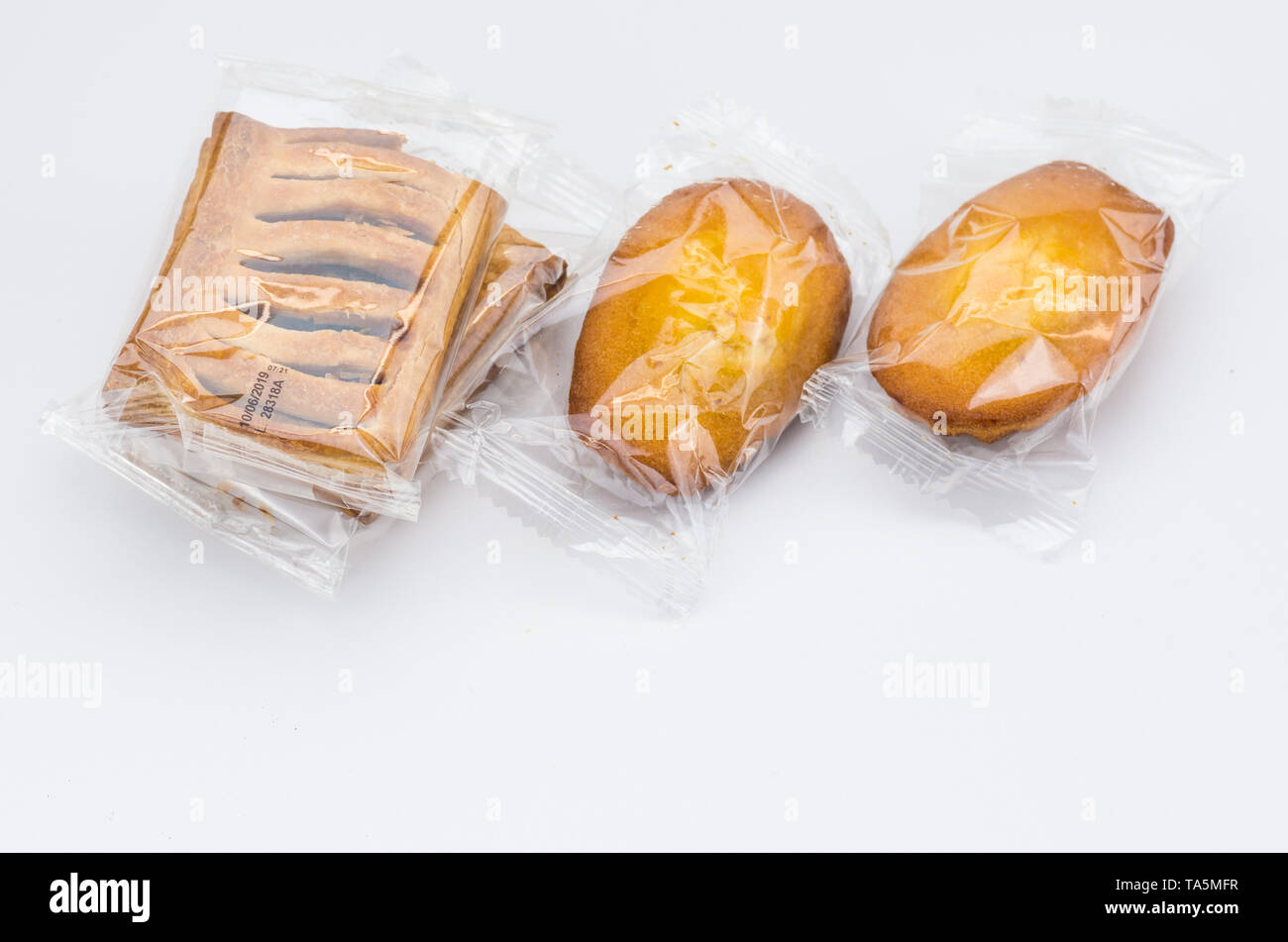 pre packaged snacks and pastries on a blank surface Stock Photo - Alamy