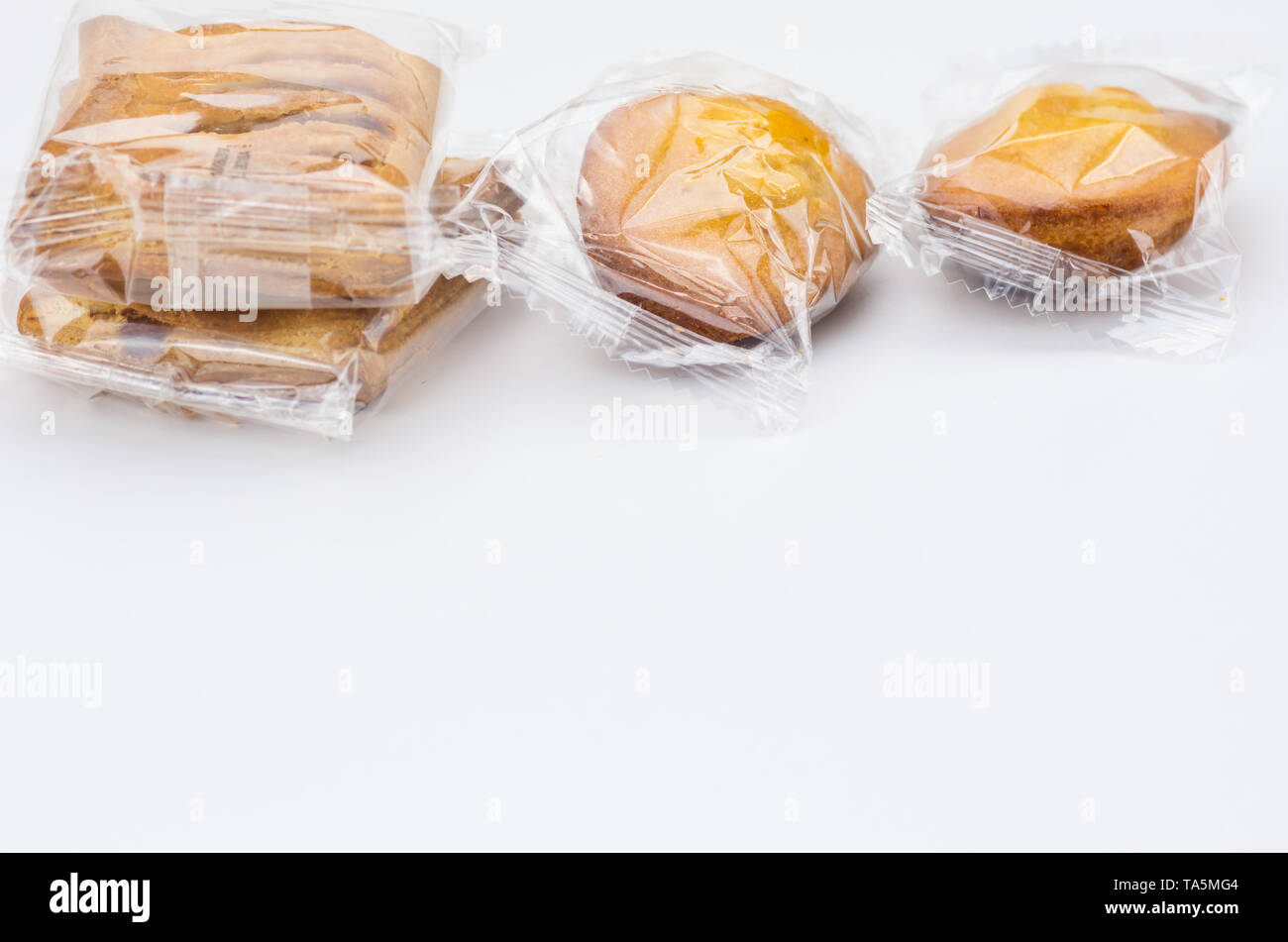 pre packaged snacks and pastries on a blank surface Stock Photo - Alamy