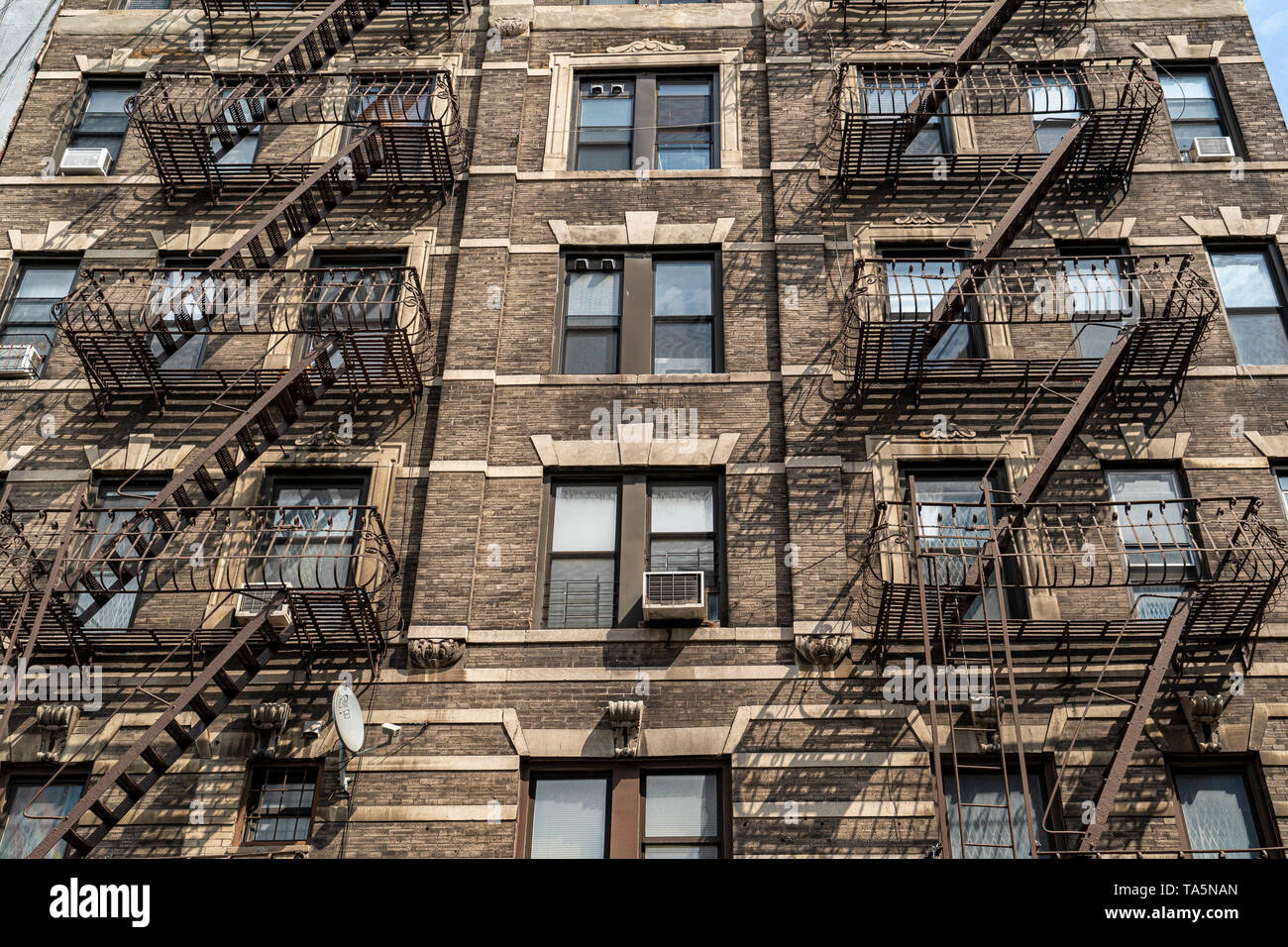 fire escape ladder in new york city building detail Stock Photo - Alamy