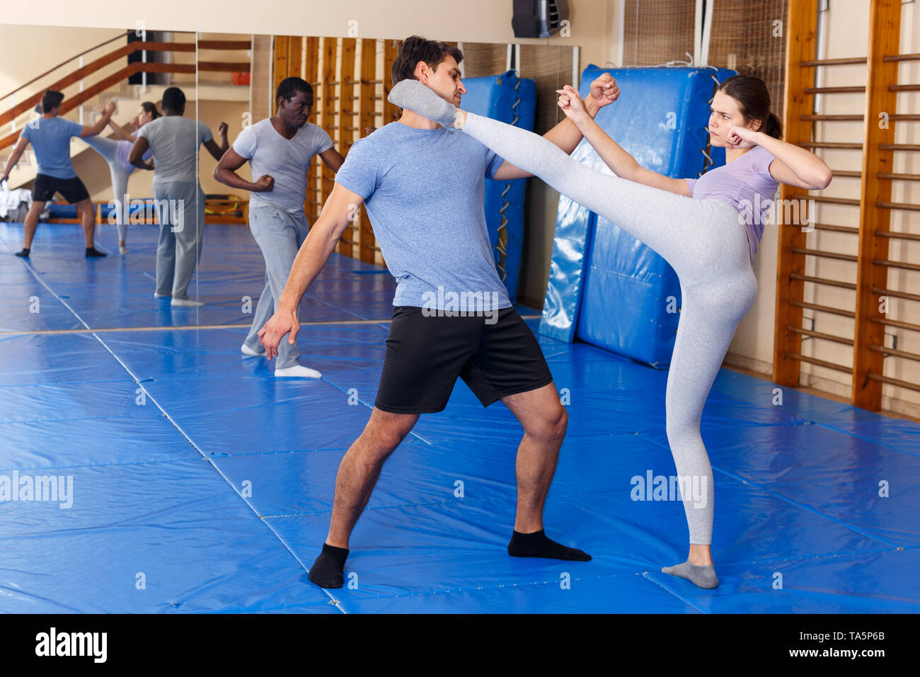 Adult people practicing effective techniques of self-defence in ...