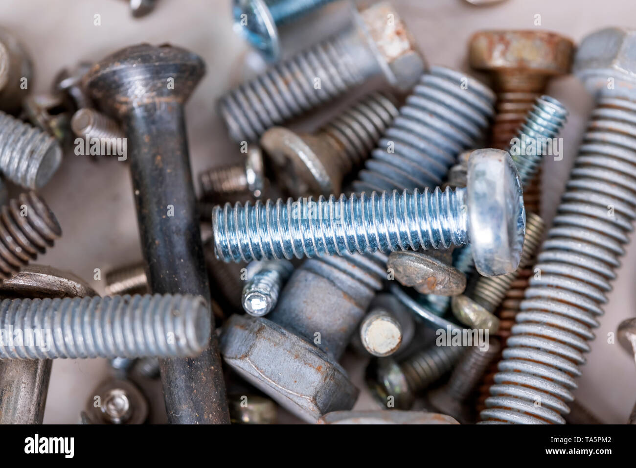 Metal bolts of different diameters, new and old, used in close-up Stock ...