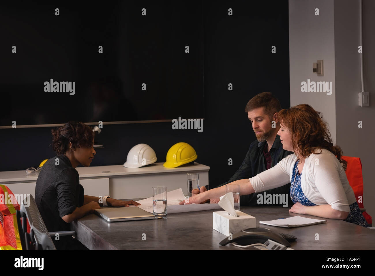 Architect business people working at blueprint and business plan Stock ...