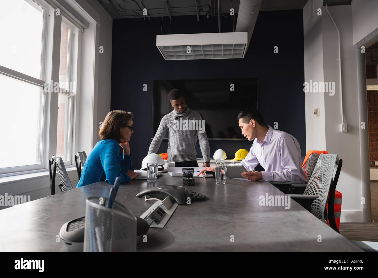 Architect business people working at blueprint and business plan Stock ...