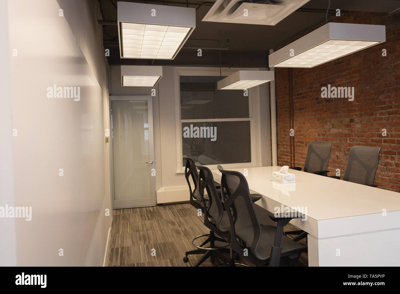 Empty chairs and table at conference room Stock Photo - Alamy