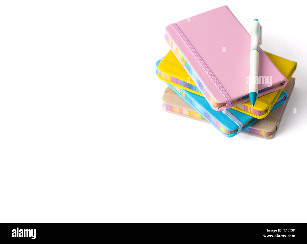 Colorful notebooks with pen isolated on white background. Back to ...