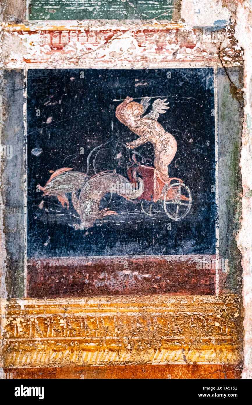 Winged Amorino leads a fish-drawn chariot in Pompeii Stock Photo - Alamy