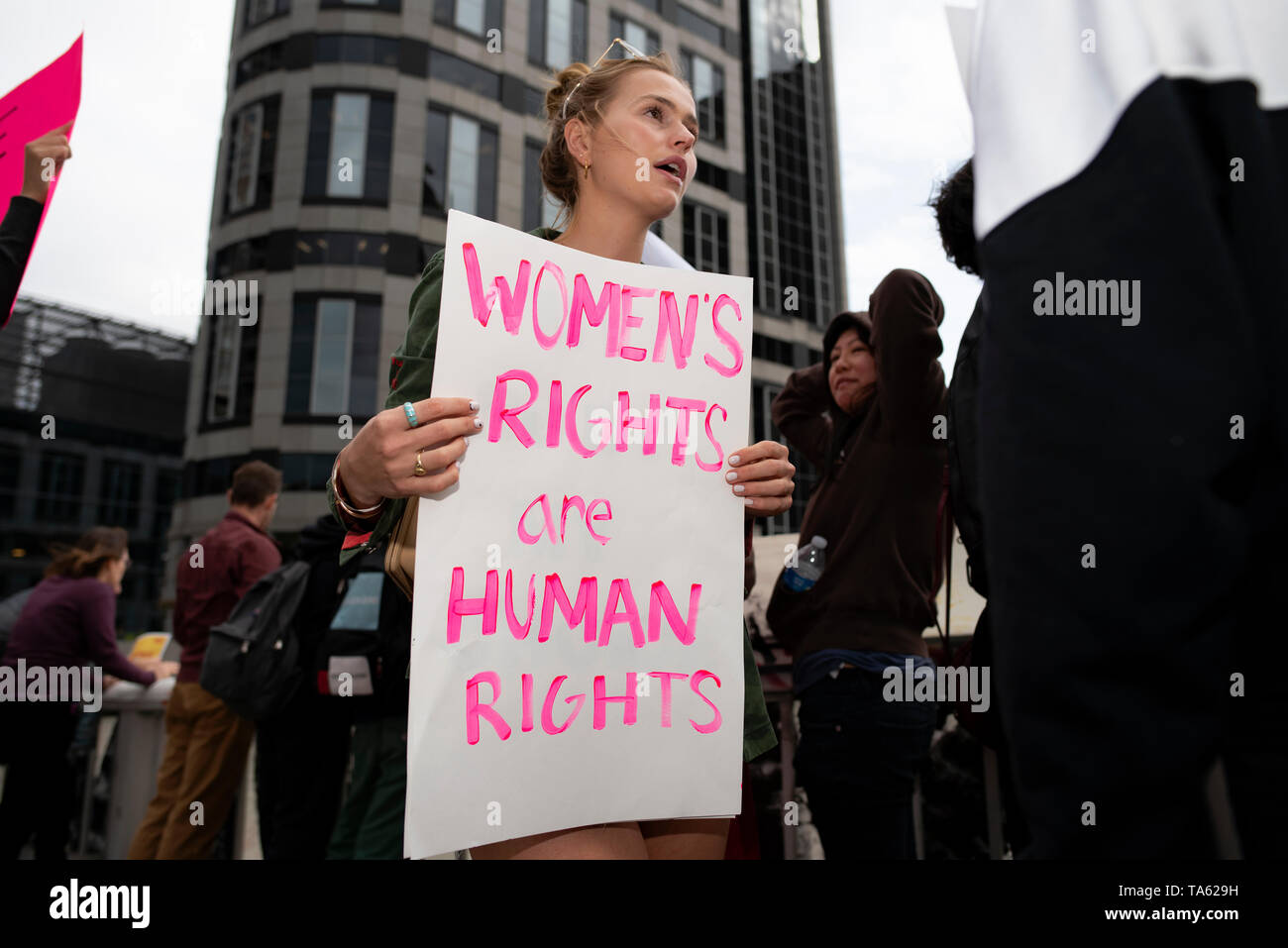 An activist seen holding a placard that says Women's Rights are Human ...