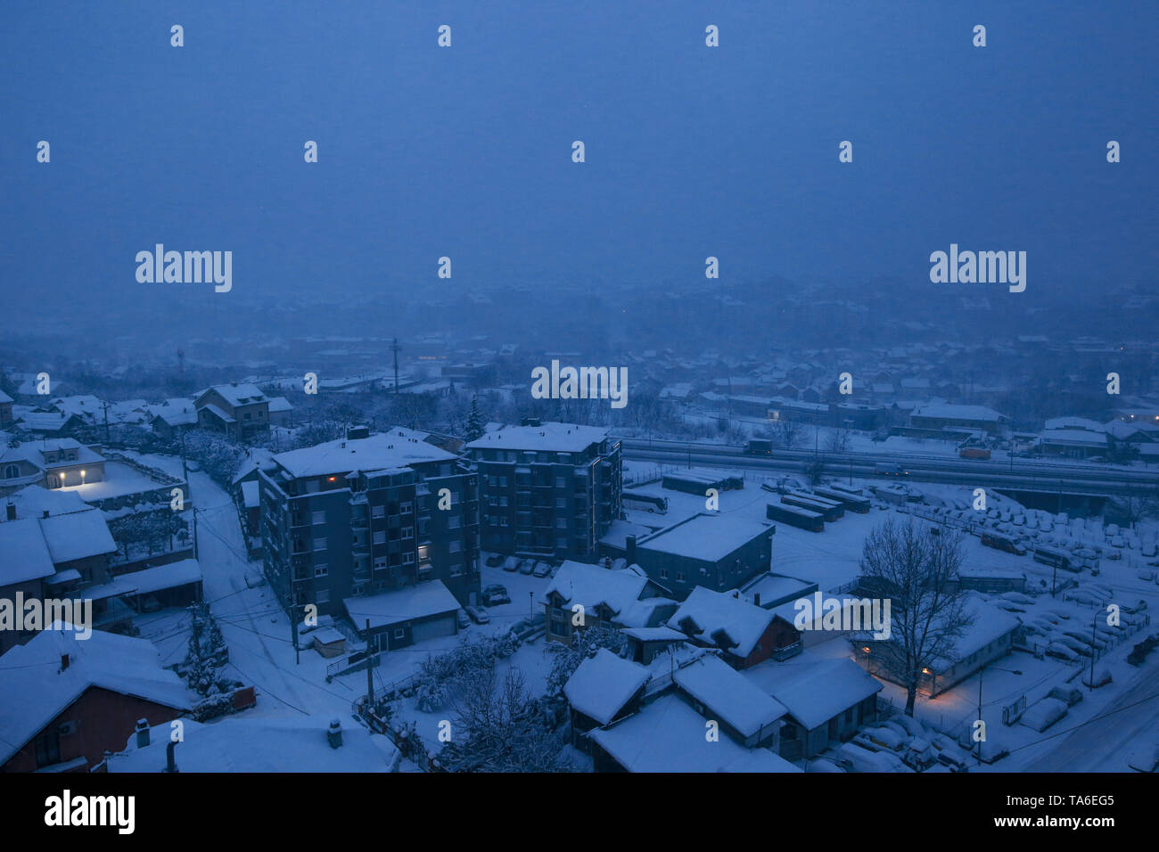 Beautiful winter view of houses and buildings with roofs covered with ...