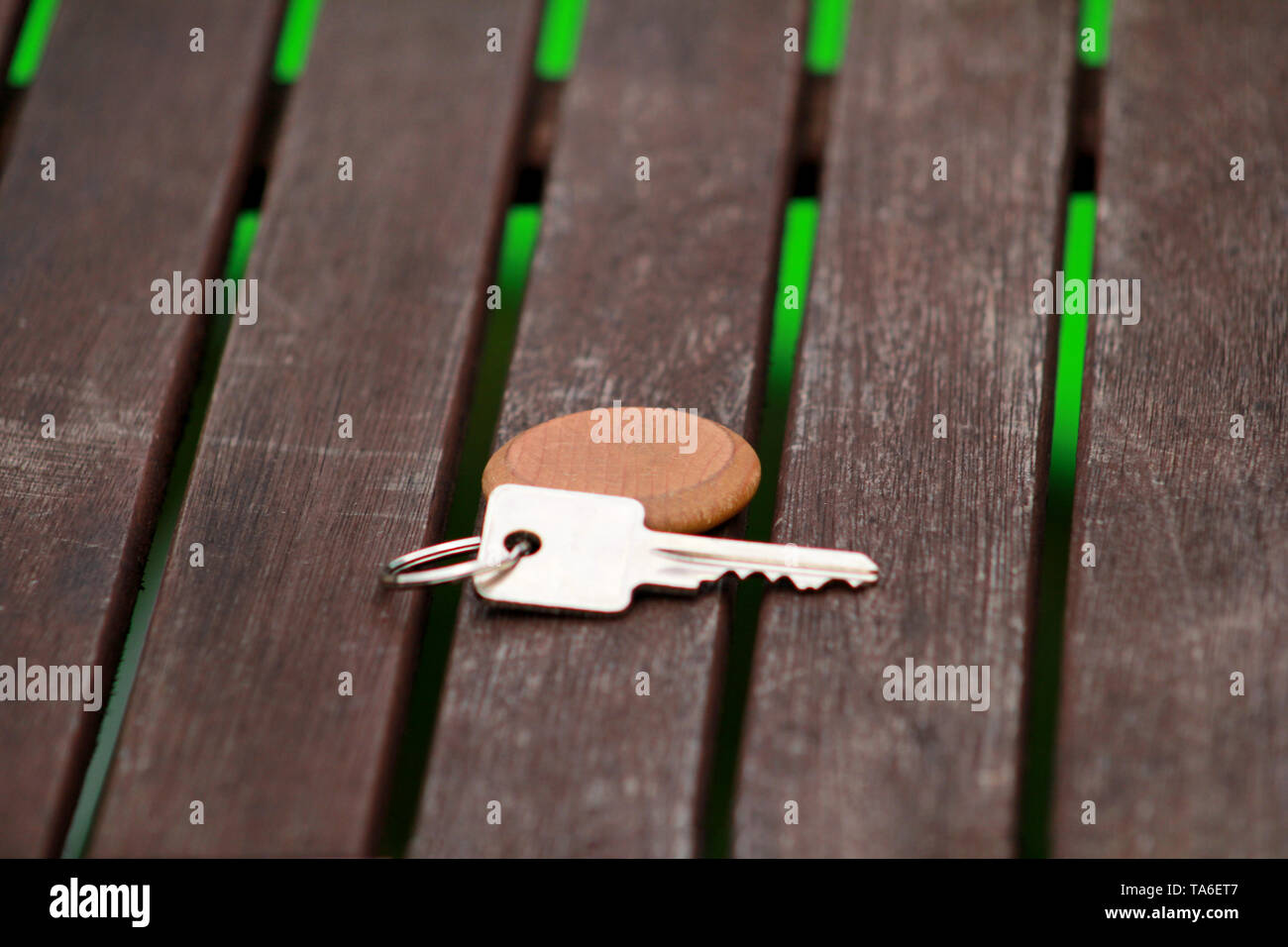 Hotel suite key with wooden fob for room on wood table. Room key on ...
