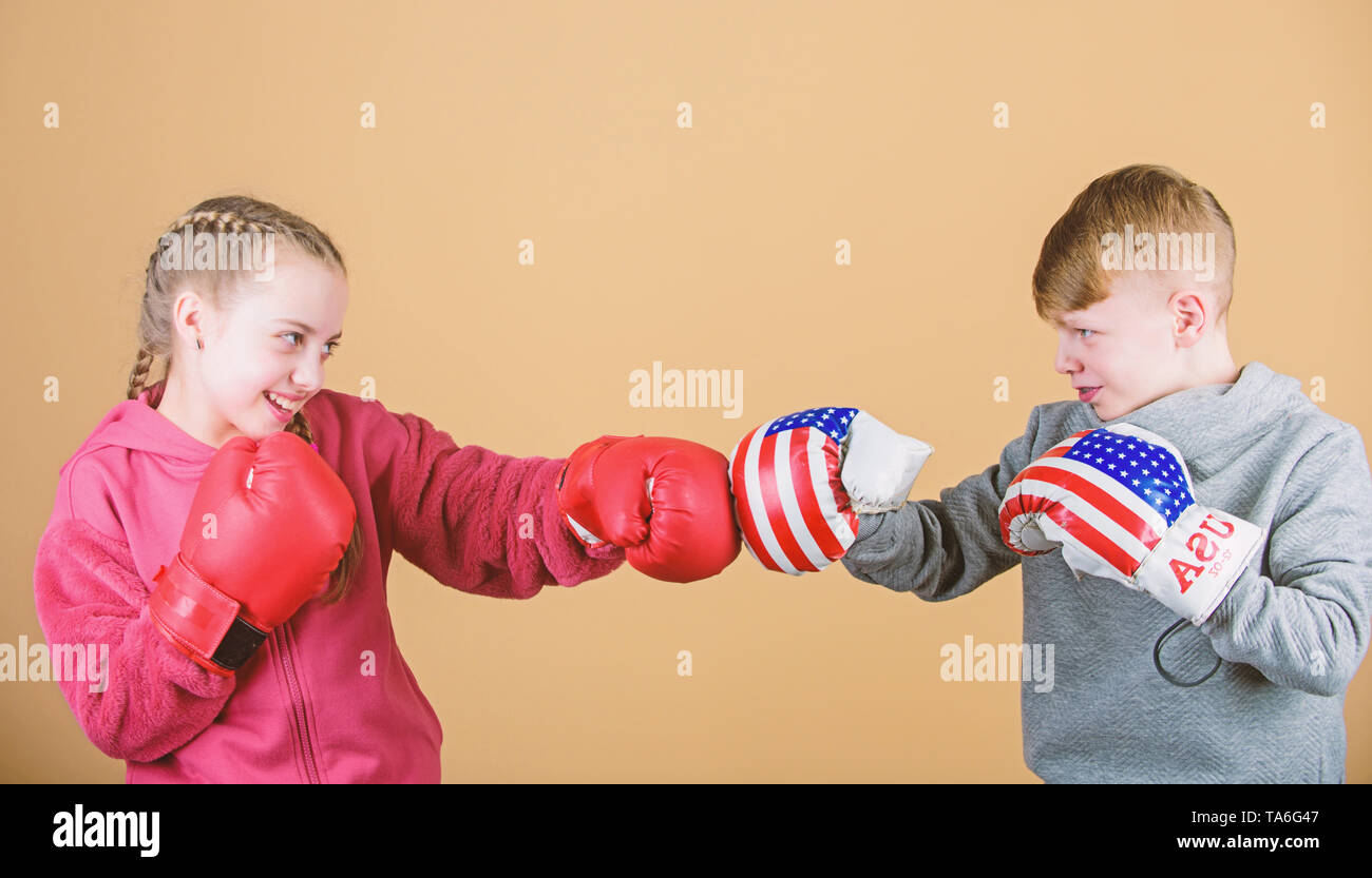 Girl and boy boxing competitors. Battle for attention. Child sporty ...