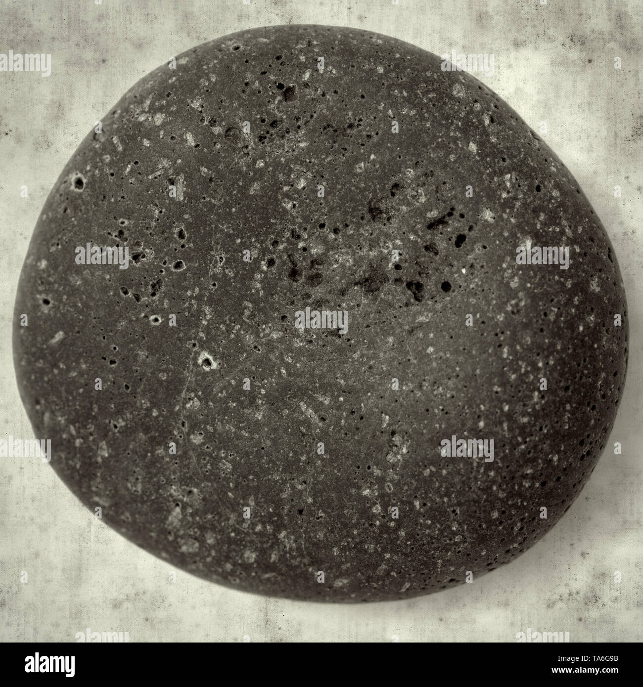 textured stylish old paper background, square, with dark lava rock ...