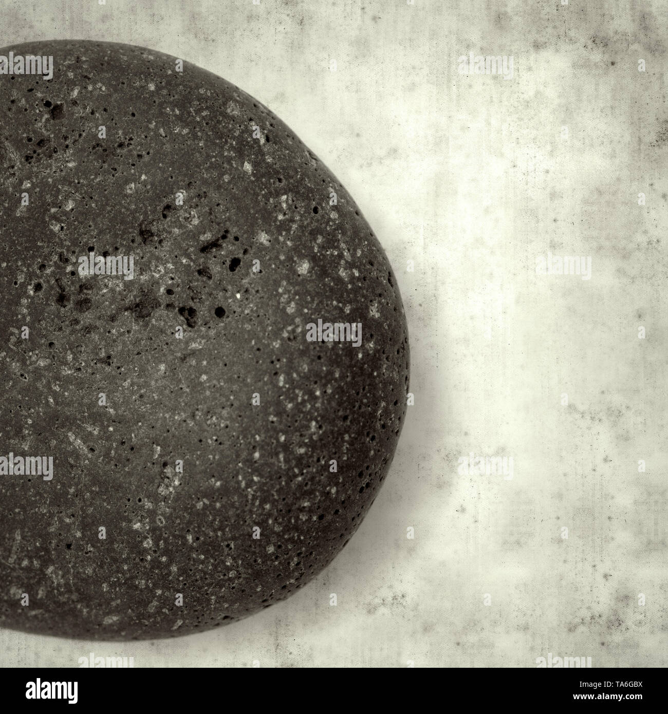 textured stylish old paper background, square, with dark lava rock ...