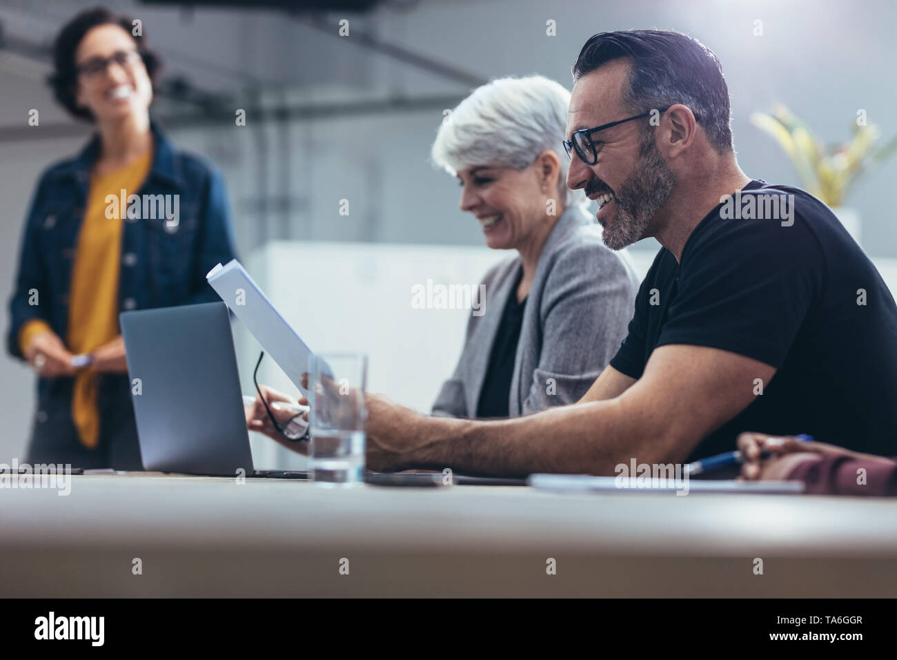 Group discussion happy paperwork hi-res stock photography and images ...