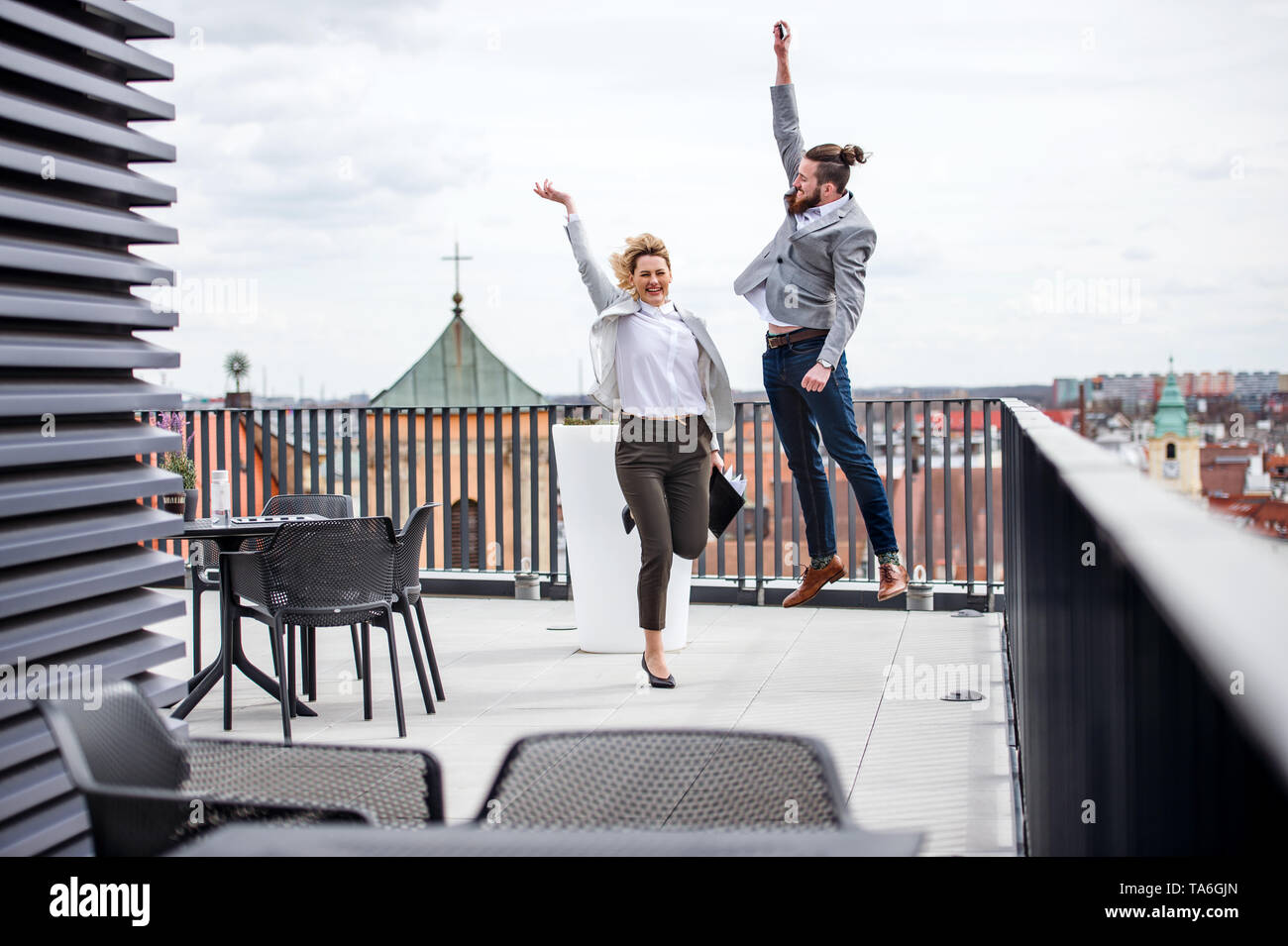 Office workers jumping hi-res stock photography and images - Alamy