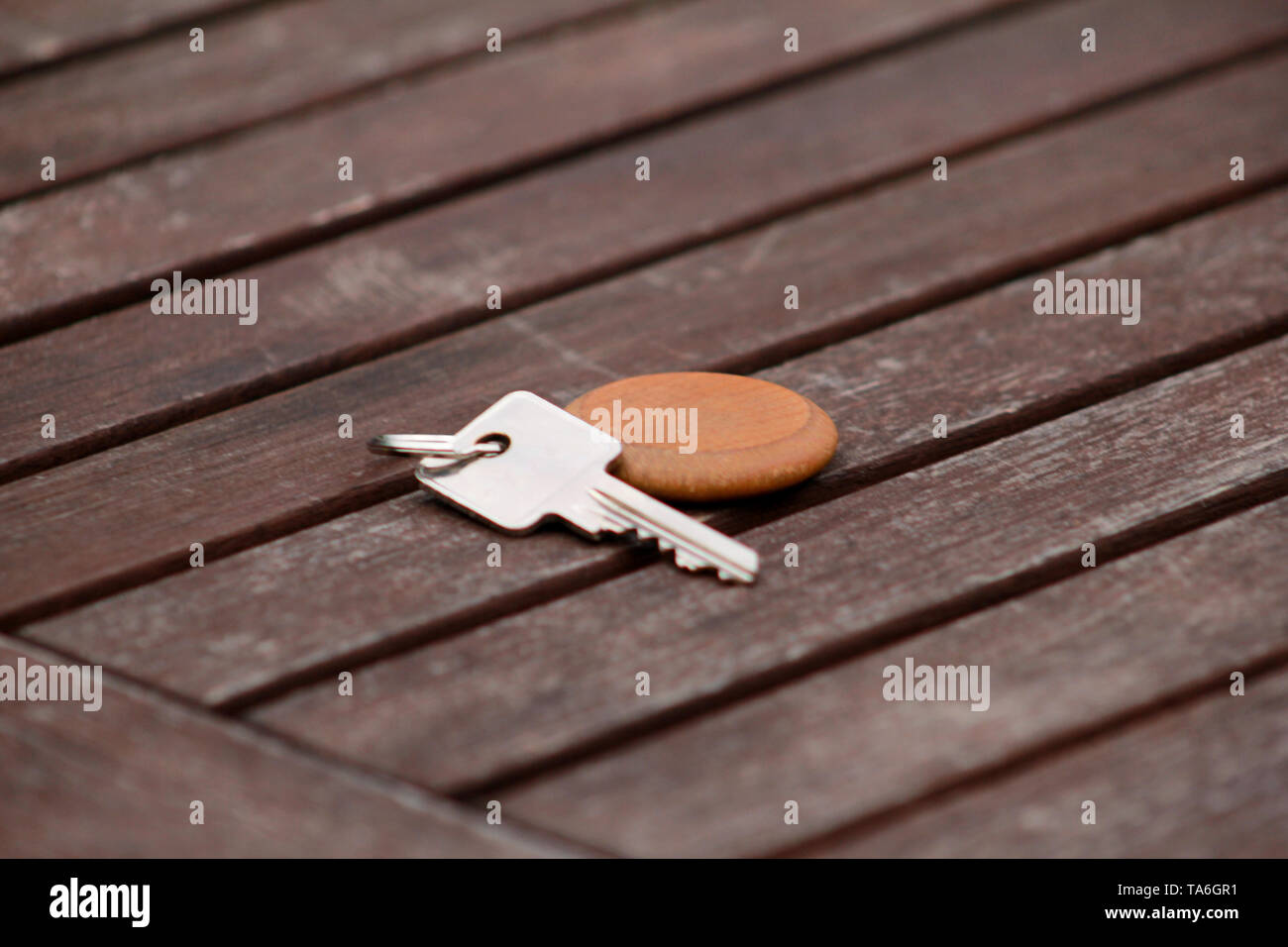 Hotel suite key with wooden fob for room on wood table. Room key on ...